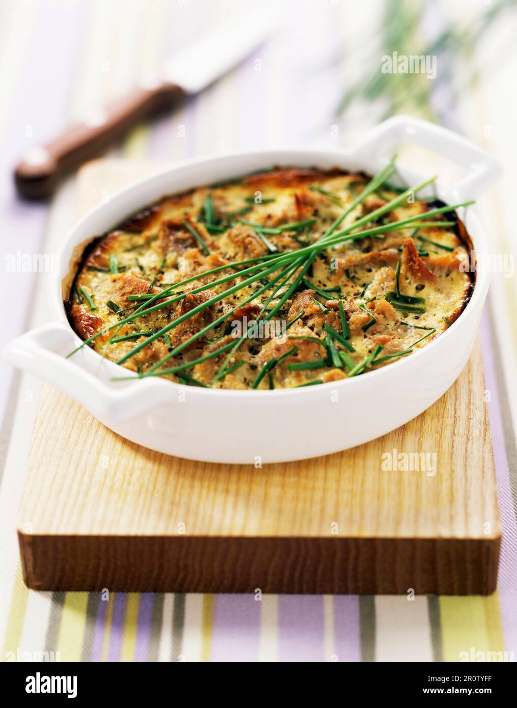 tuna and chive clafoutis batter pudding Stock Photo - Alamy