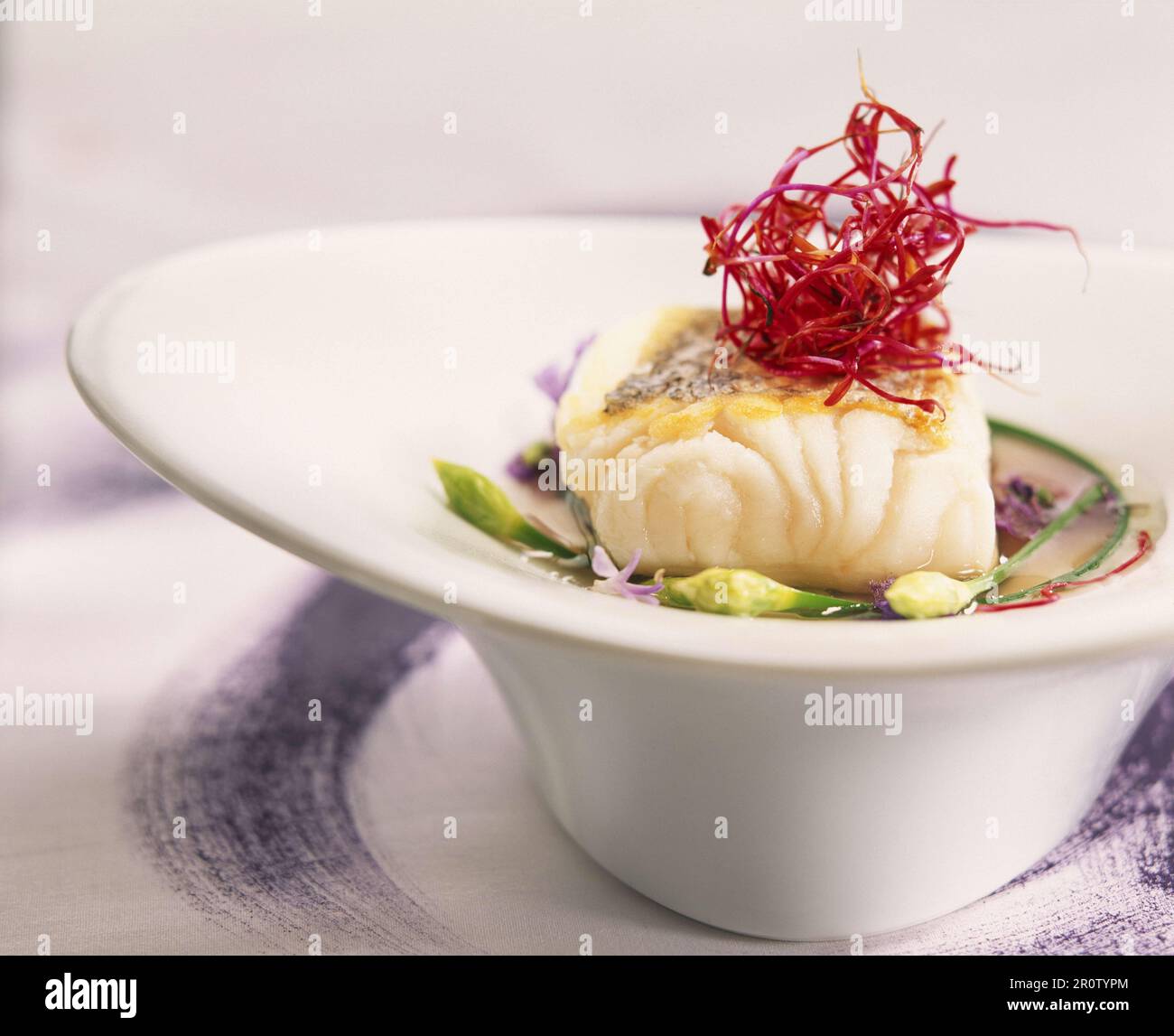 Cod with mauve soup and chinese garlic Stock Photo - Alamy