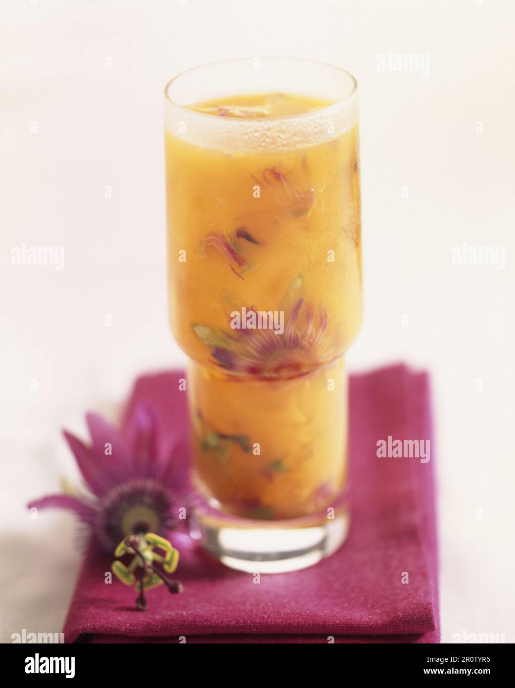 Orange juice with passionfruit flowers Stock Photo - Alamy