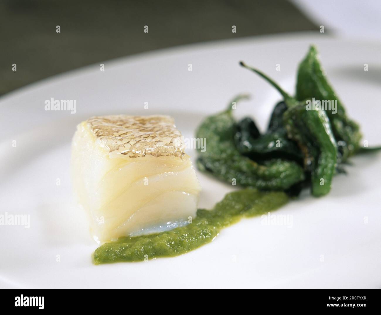 cod confit, green pepper sauce Stock Photo - Alamy