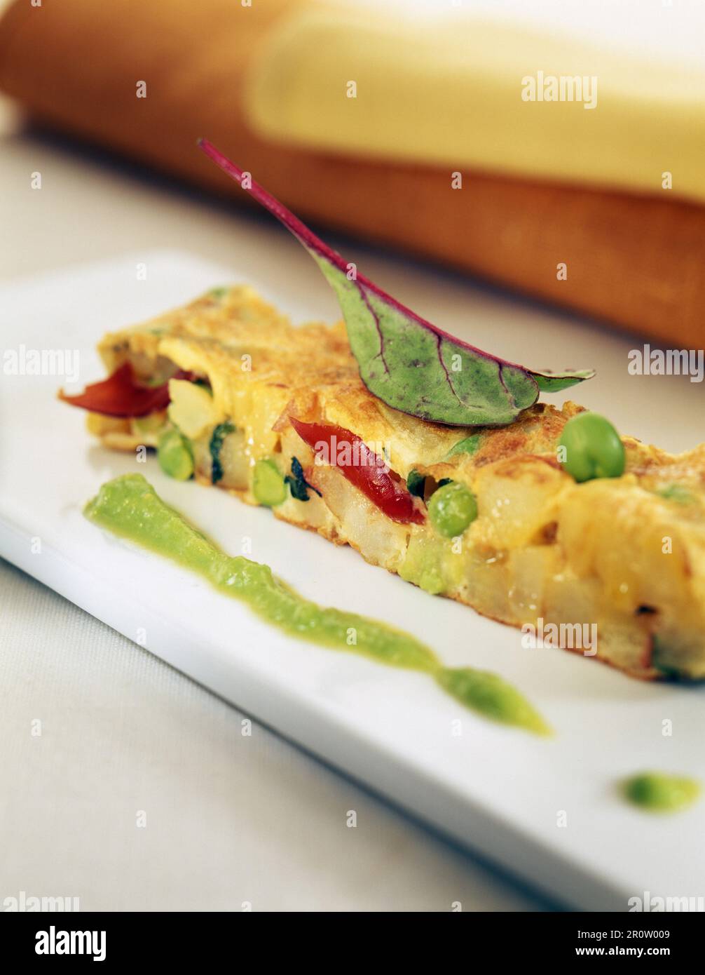 Vegetable omelet with peas and tomatoes Stock Photo - Alamy