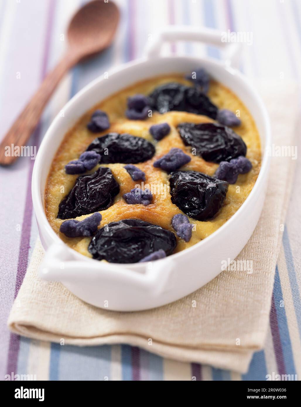 prune clafoutis batter pudding (topic: Robuchon recipe Stock Photo - Alamy