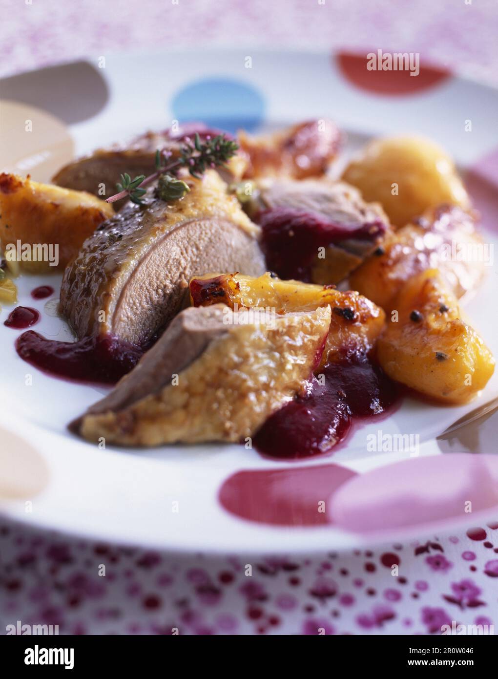Roasted duckling with cranberry sauce Stock Photo - Alamy
