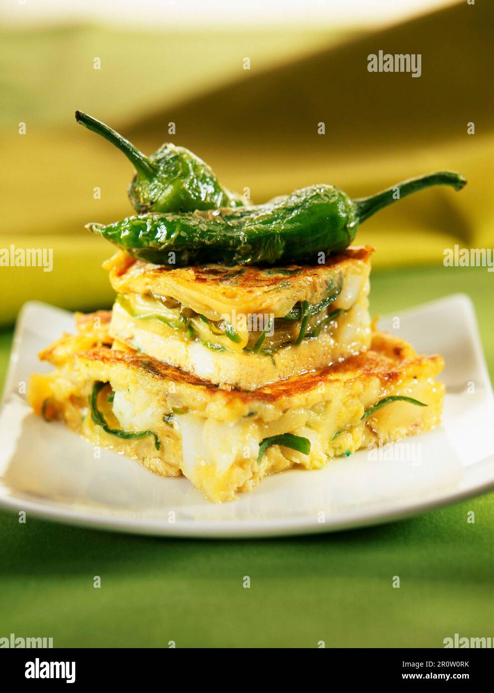 Potato, cod and green pepper omelette Stock Photo - Alamy