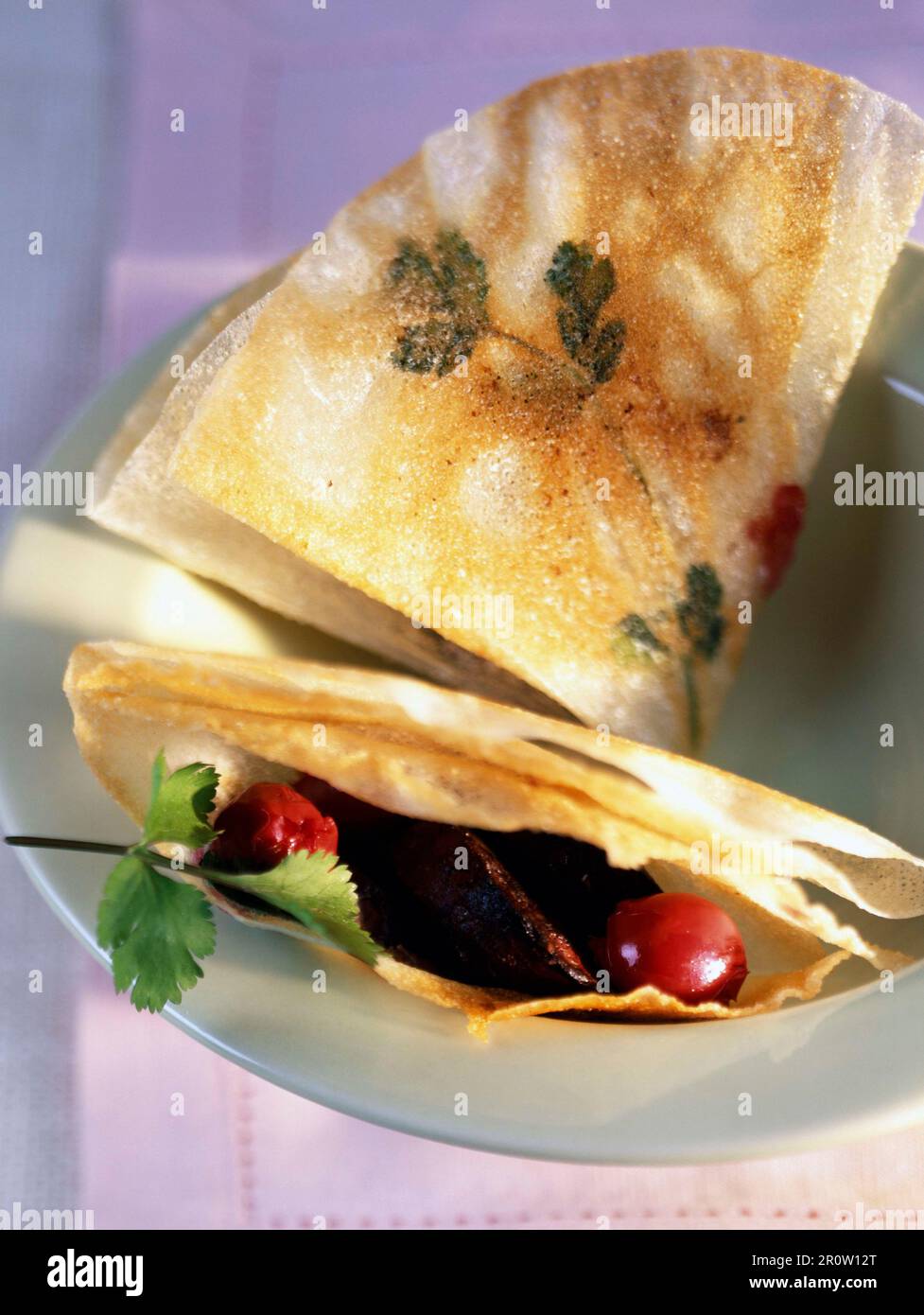 Blood sausage and cherry triangles Stock Photo - Alamy