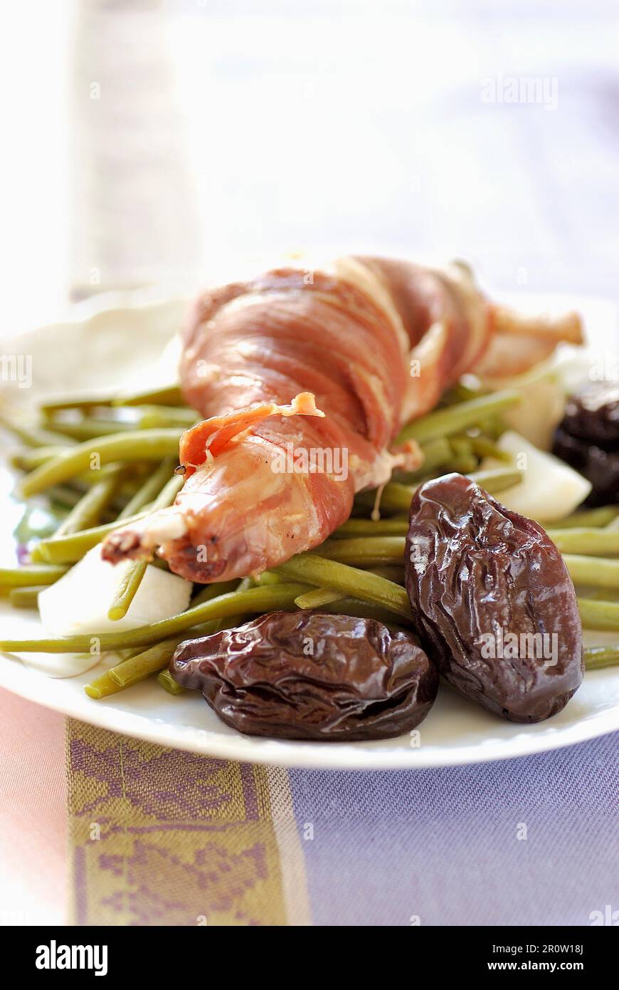 Rabbit with Prunes and Ham Stock Photo - Alamy