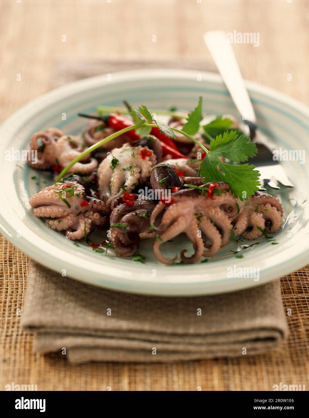 Marinated octopus with mild pepper dressing Stock Photo - Alamy
