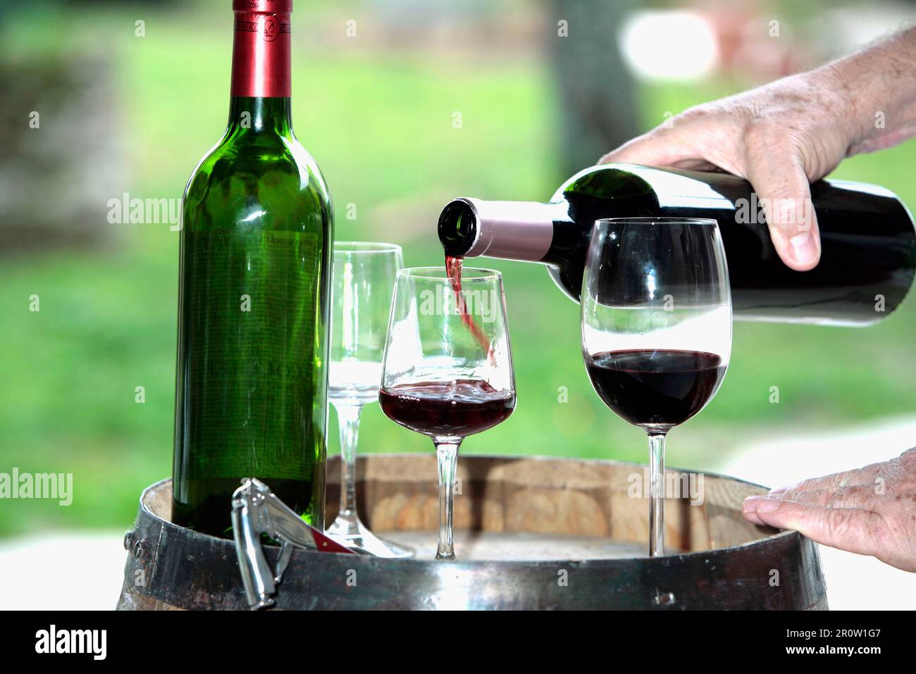 Human hand pouring drink out hi-res stock photography and images - Alamy