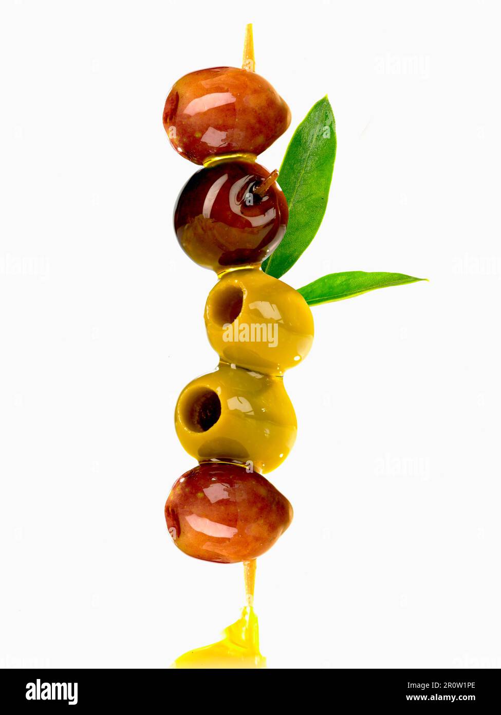 Olive brochette with olive oil Stock Photo - Alamy