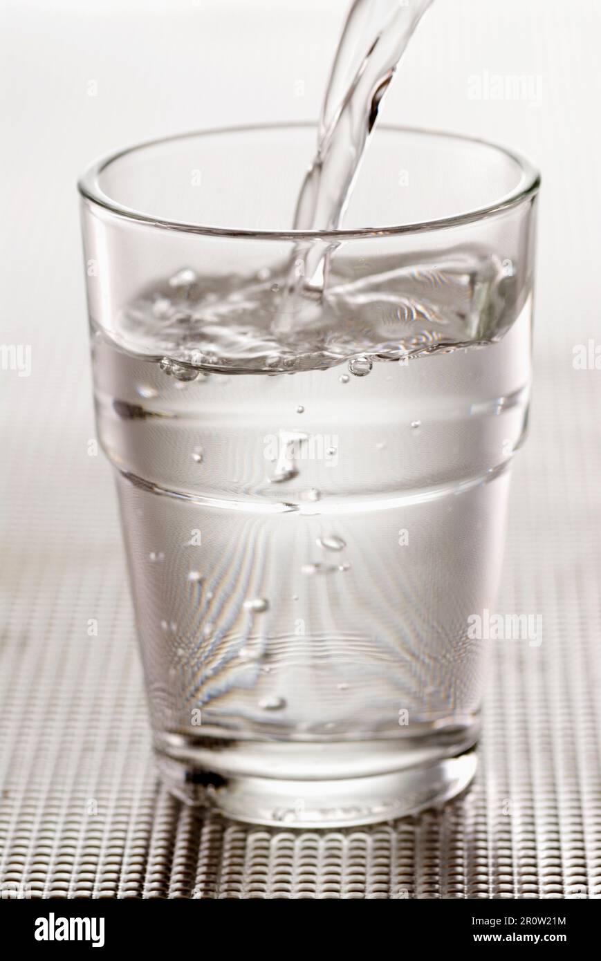 Pouring a glass of water Stock Photo - Alamy