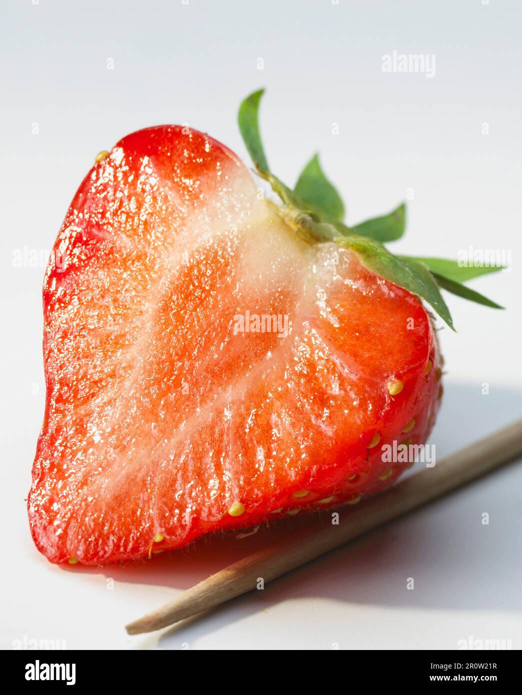 Strawberry cut in half Stock Photo - Alamy