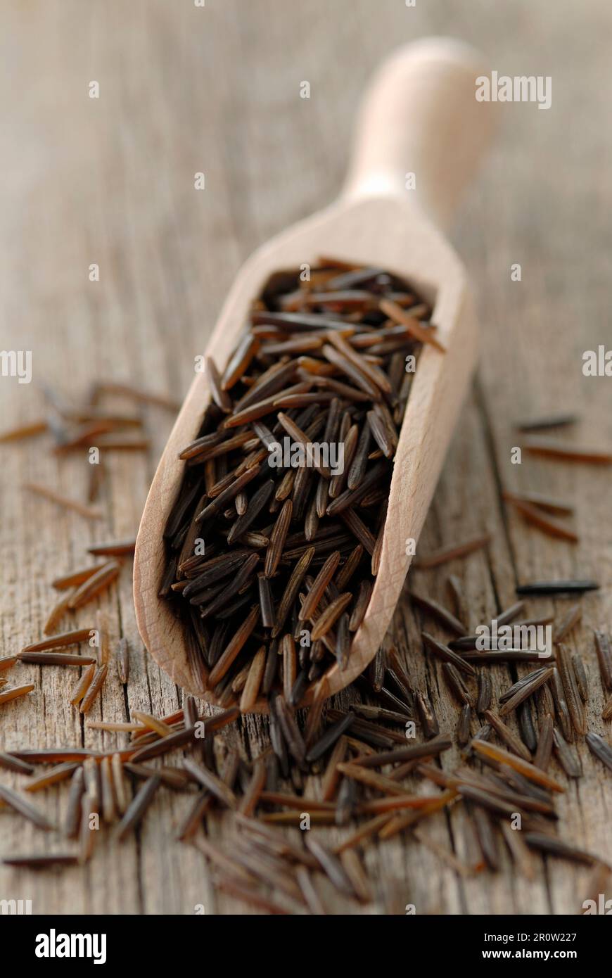 Small shovel of wild rice Stock Photo - Alamy