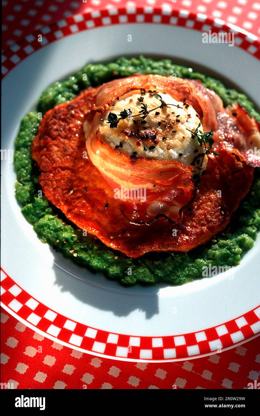 Grilled crottins (small round goat's cheese) with red and green pepper ...