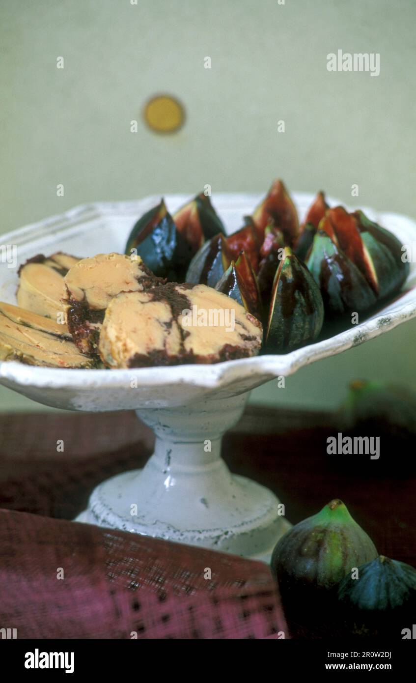 Champagne figs with foie gras on a cake stand Stock Photo - Alamy