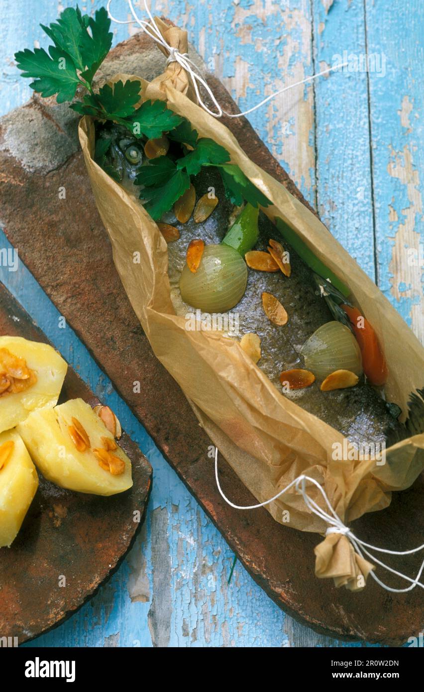 Alsatian-style trout in parchment paper with almonds, onions and ...