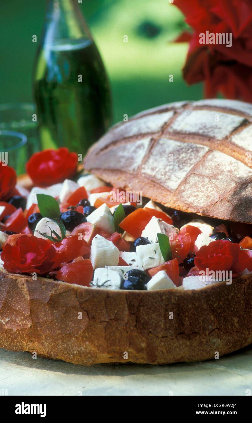 Provençal-style stuffed bread with tomatoes, feta cheese and black ...
