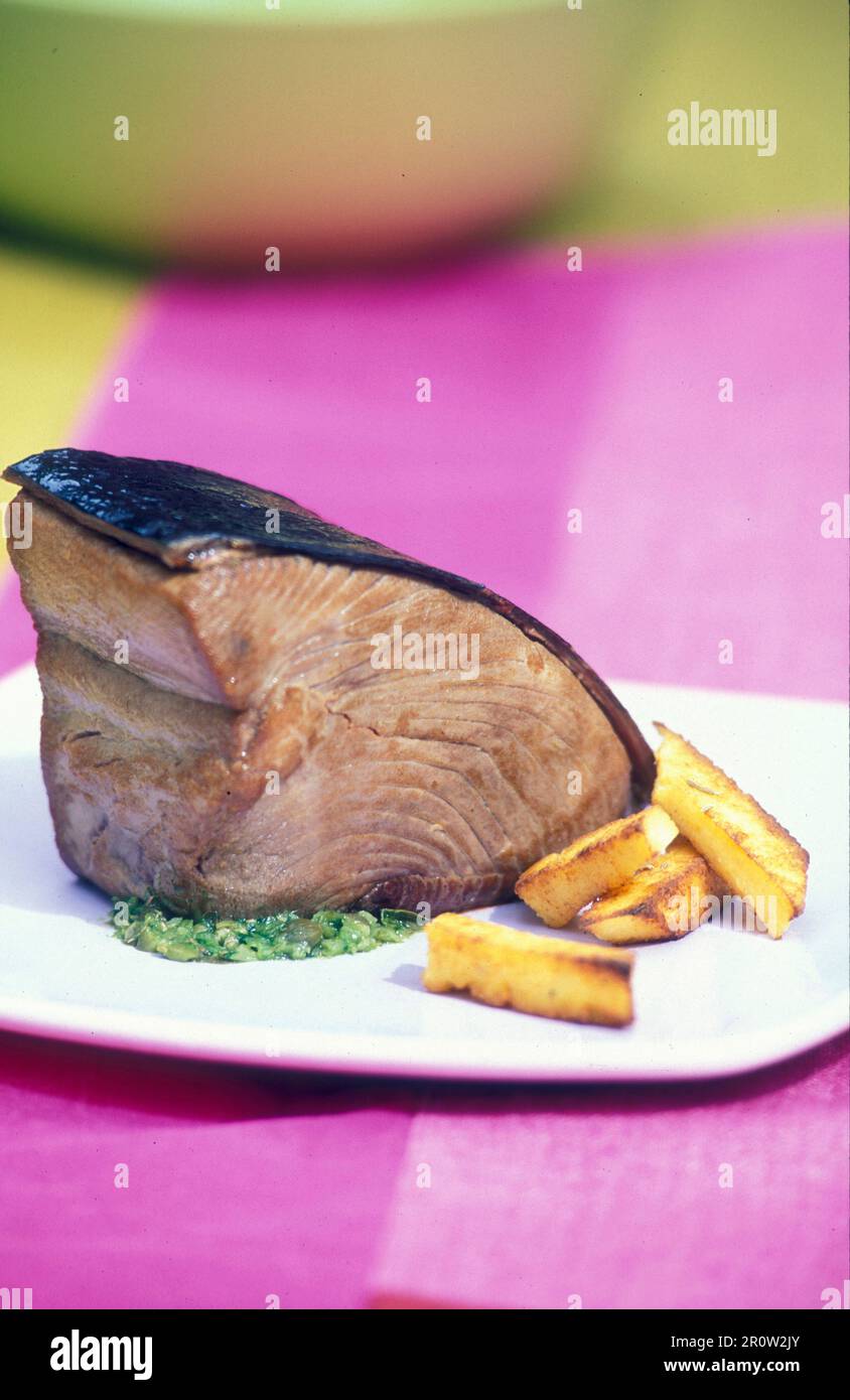 Tuna fish steak with polenta chips Stock Photo - Alamy