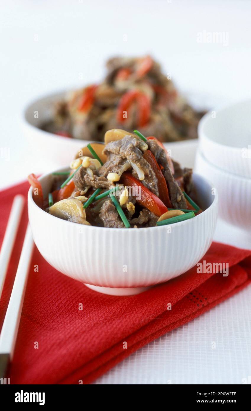 Beef with soya sprouts, peppers and mushrooms Stock Photo - Alamy