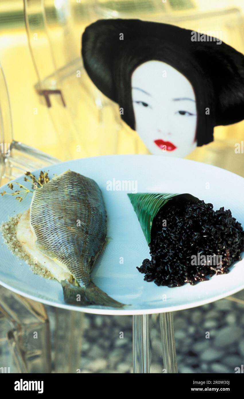 Sea bream with black rice Stock Photo - Alamy