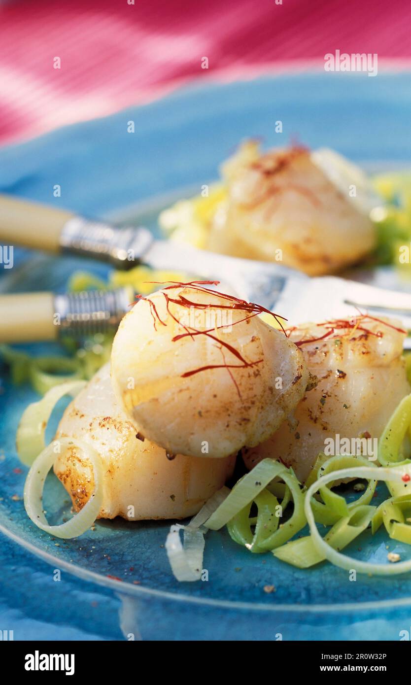 Scallops with saffron Stock Photo - Alamy