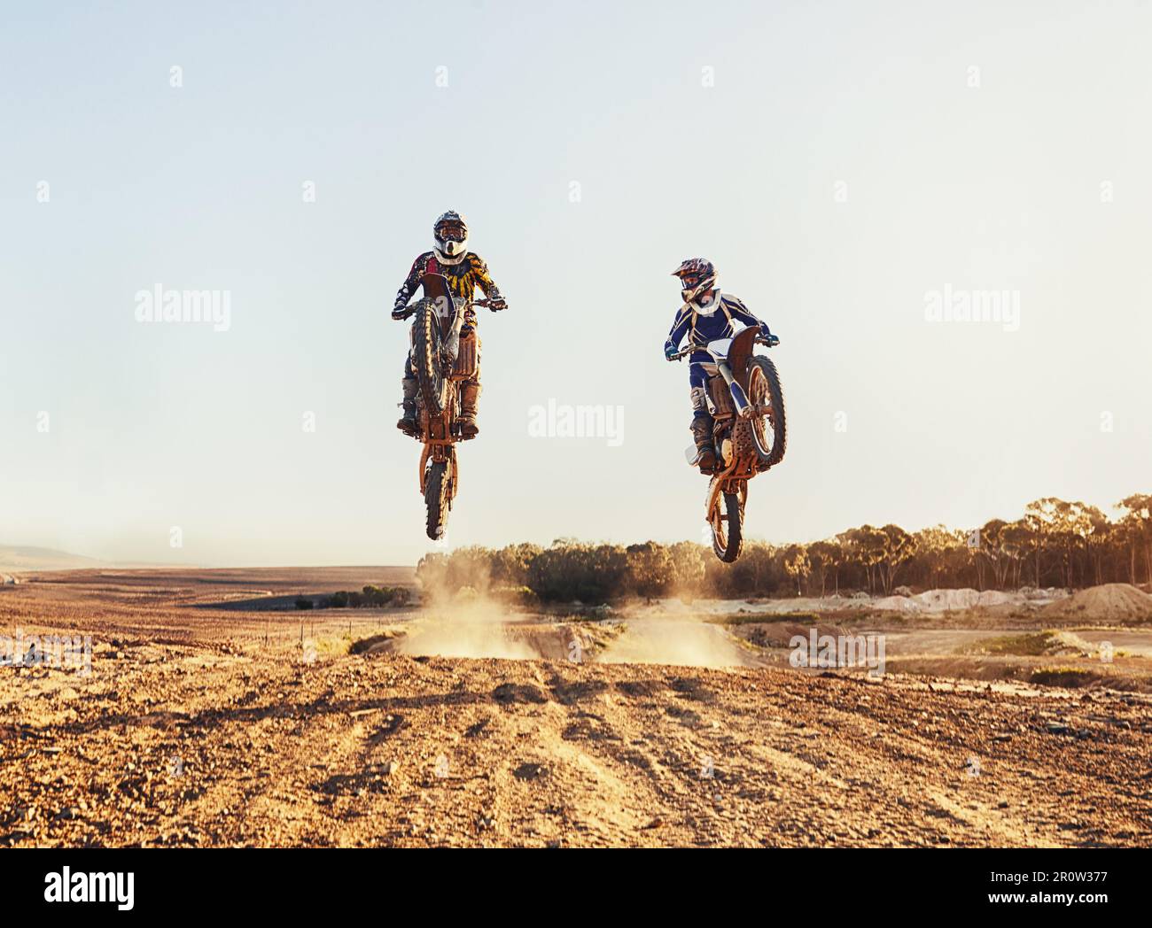 Finally...a challenge. A shot of two motocross riders racing side by ...