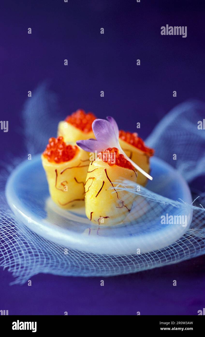 Small ratte patatoes filled with trout roe and saffron Stock Photo - Alamy