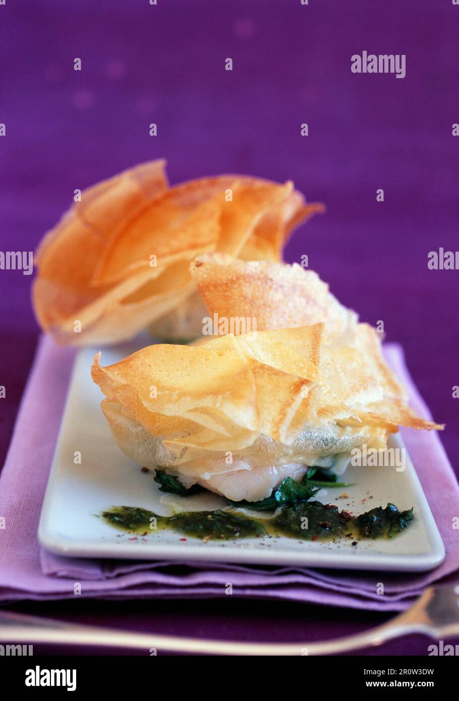 Scallop,spinach and fresh herb filo pastry purse Stock Photo - Alamy