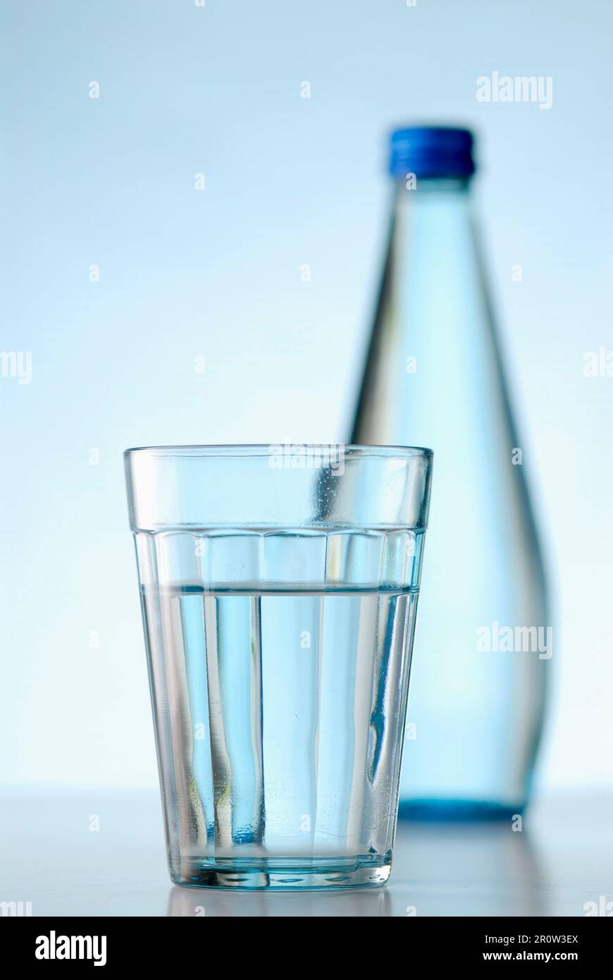 Glass and bottle of water Stock Photo - Alamy