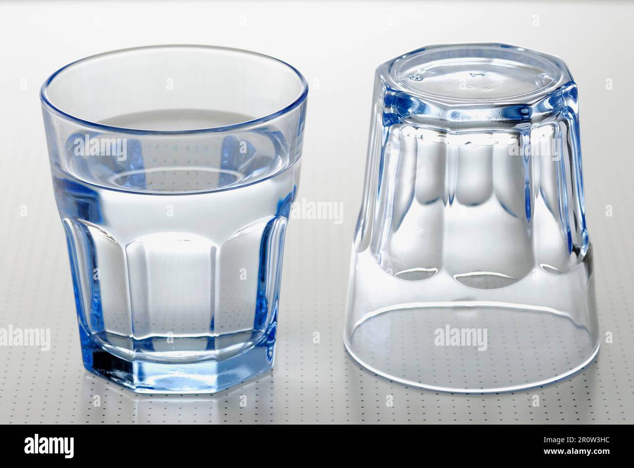 Glass of water and empty glass Stock Photo - Alamy