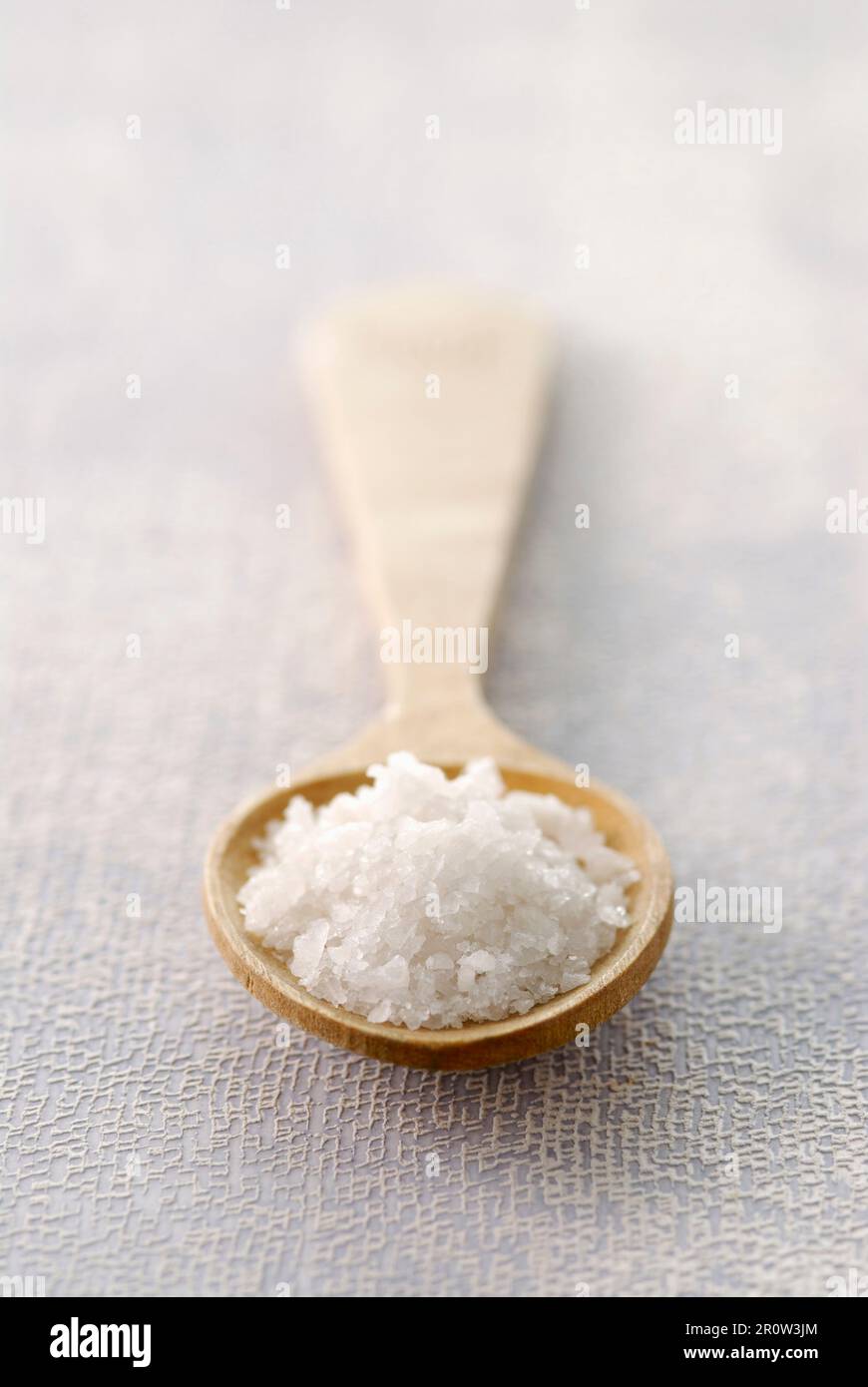 Spoonful of coarse salt Stock Photo - Alamy