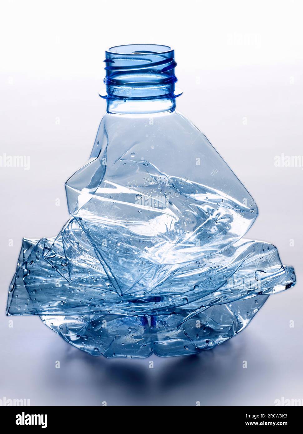 Crushed and empty plastic water bottle Stock Photo - Alamy