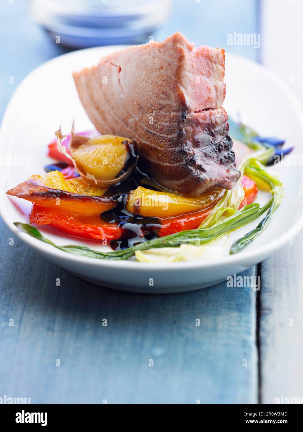 Medium-cooked tuna, peppers confit and balsamic caramel Stock Photo - Alamy