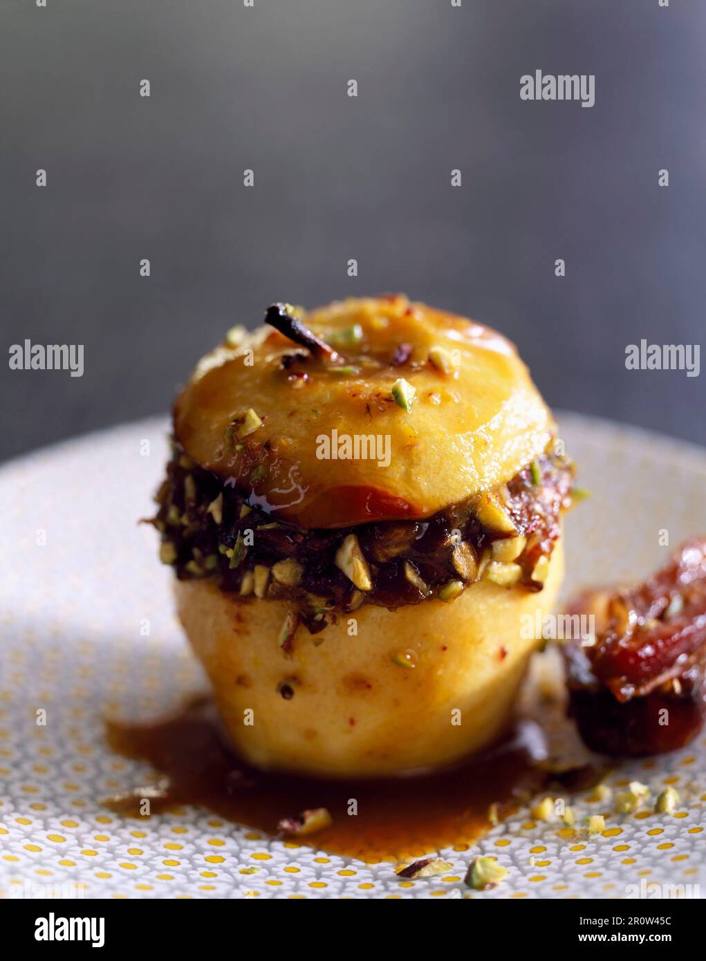 Baked apple with dates Stock Photo - Alamy