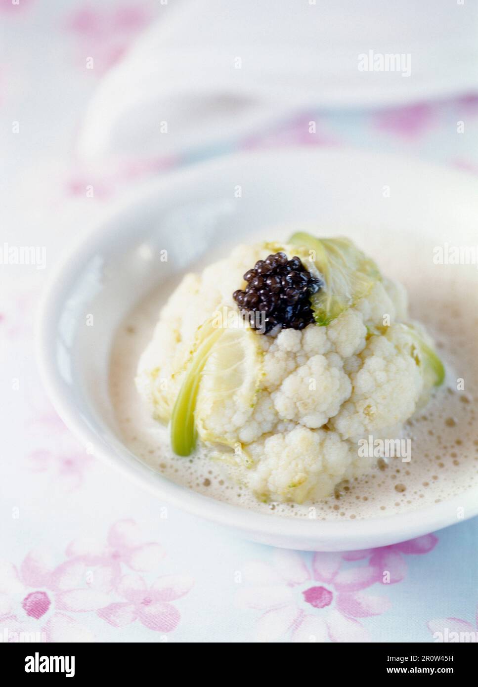 Cauliflower with caviar and fish stock Stock Photo - Alamy