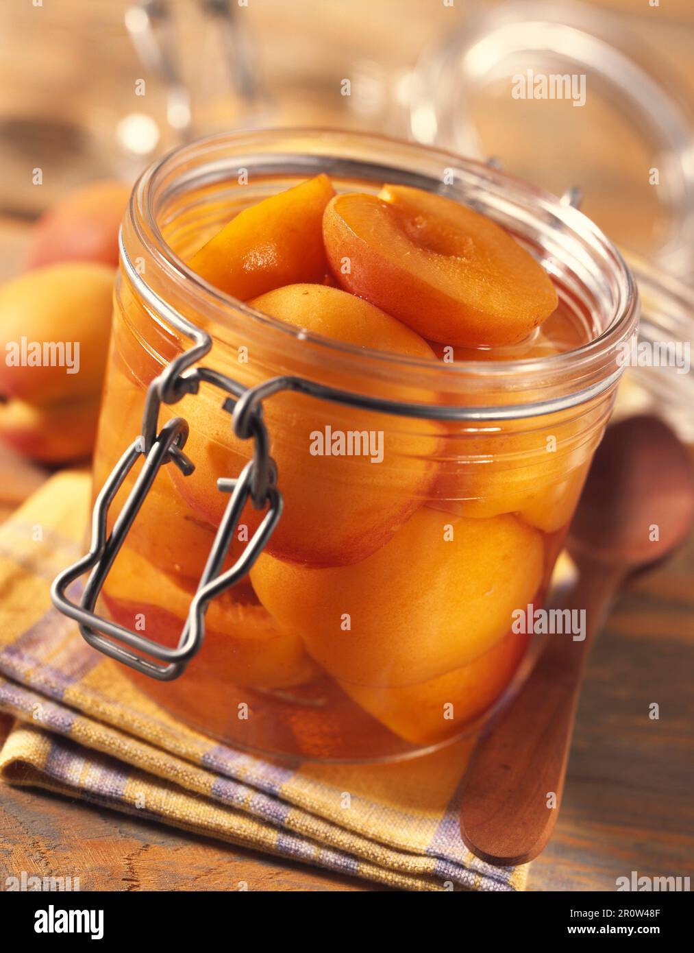 Jar of apricots in syrup Stock Photo - Alamy