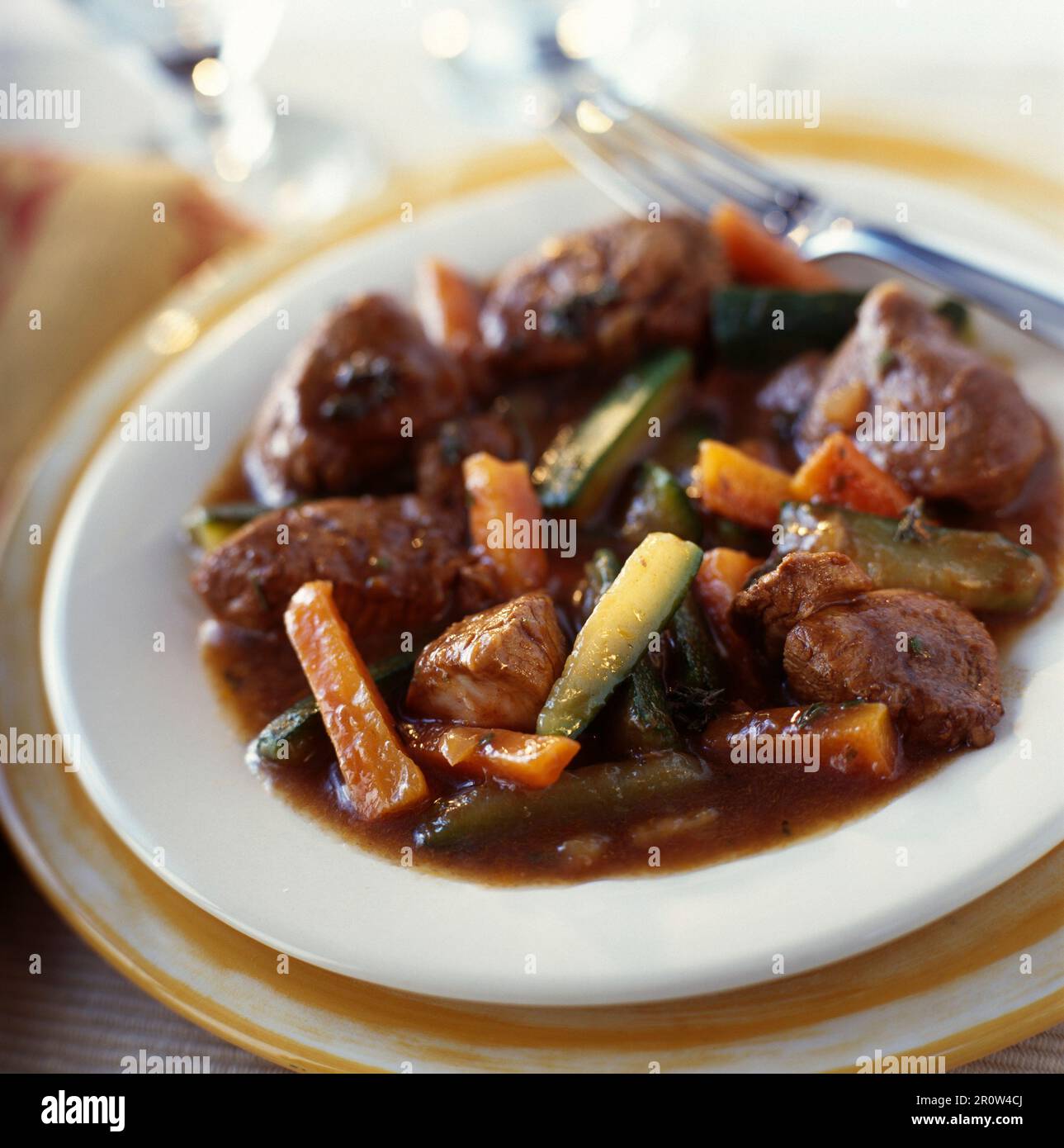 Lamb sauté with carrots and zucchinis Stock Photo - Alamy