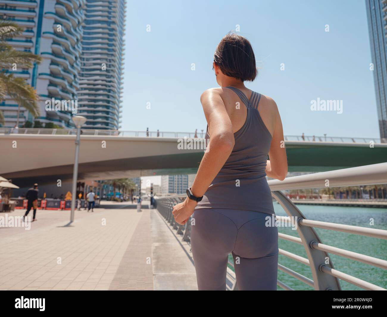 City Running - asian woman runner , Dubai marina urban scene in ...