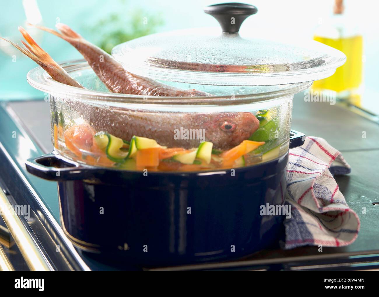 Steam-cooked red mullet and vegetables Stock Photo - Alamy