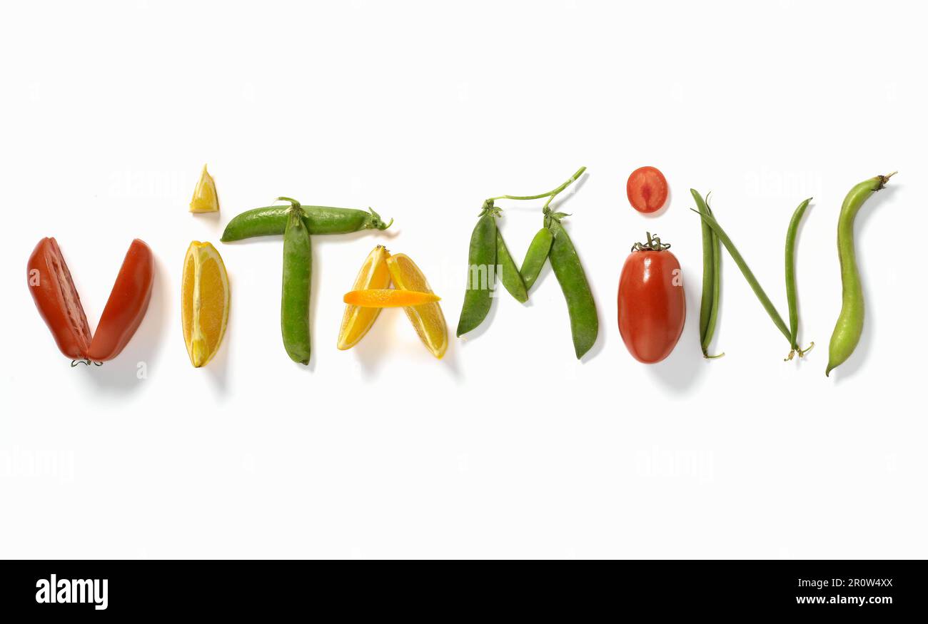 """Vitamins"" written with fruit and vegetables Stock Photo - Alamy