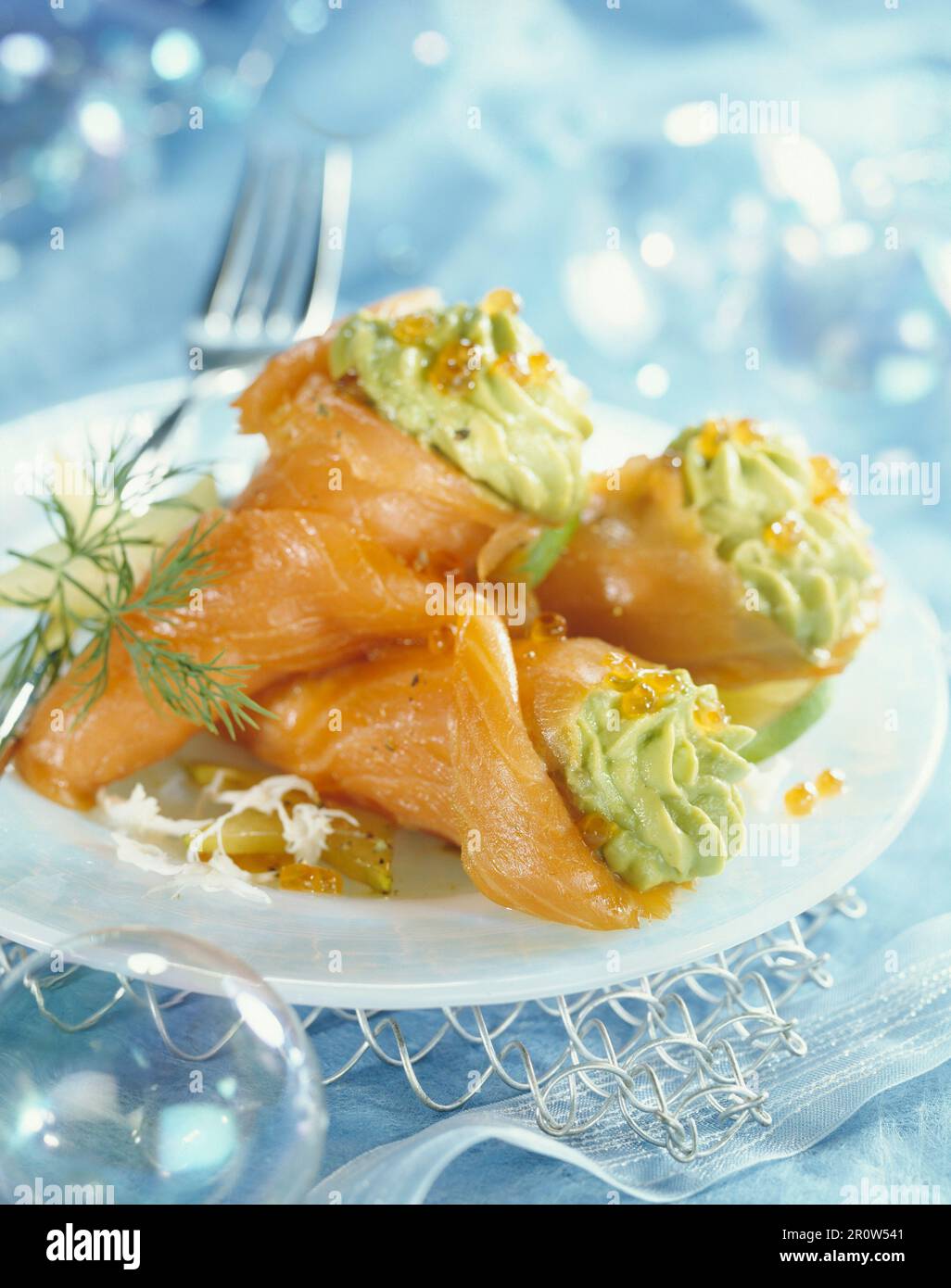 Smoked salmon cones filled with guacomole and crab Stock Photo - Alamy