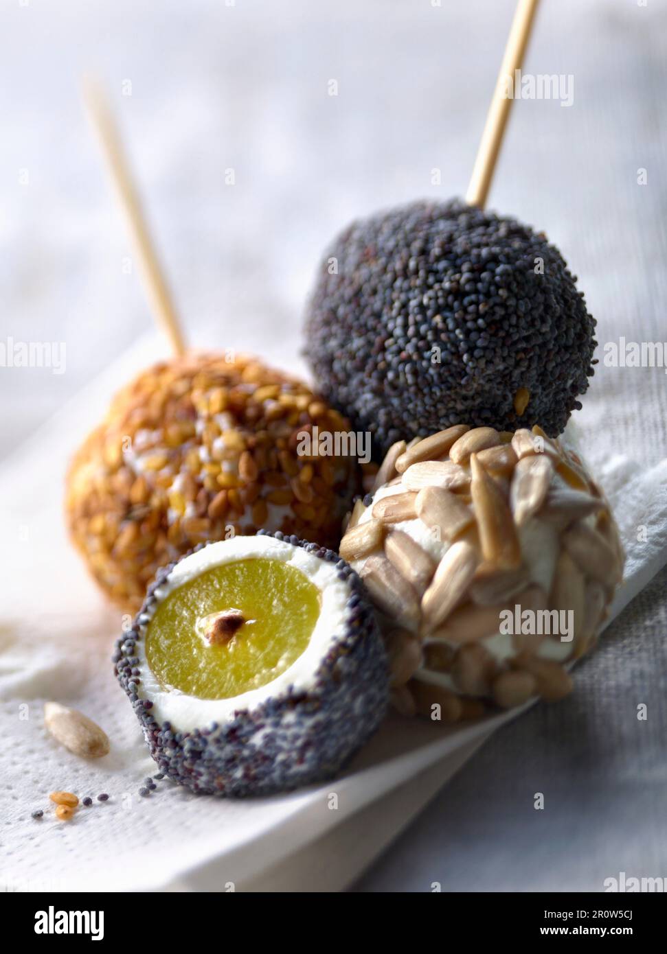 Organic goat's cheese balls coated with different seeds Stock Photo - Alamy