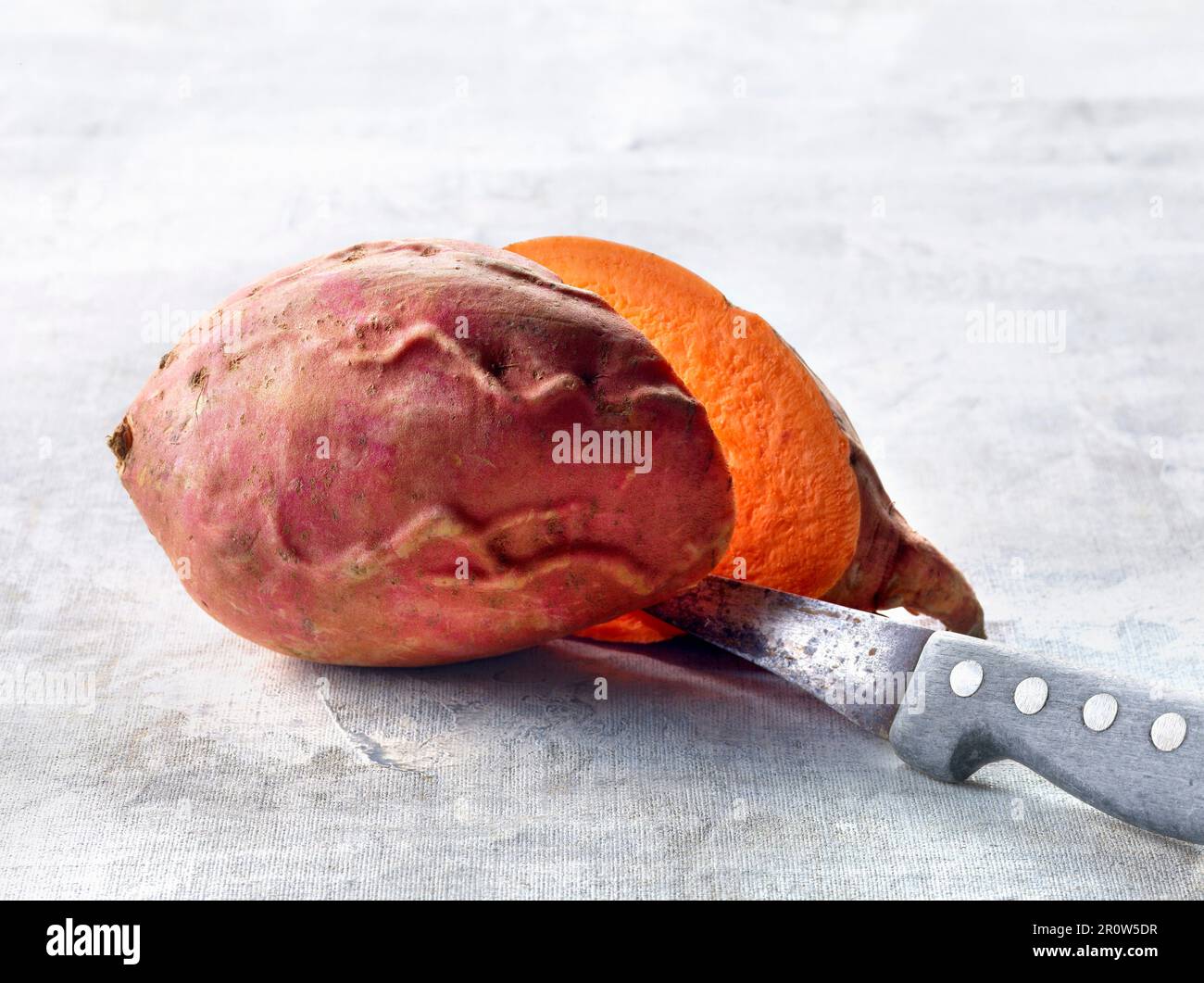 Sweet potato cut in half Stock Photo - Alamy