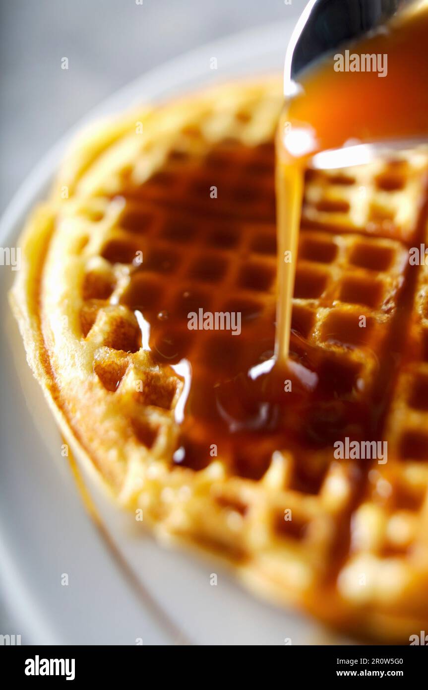 Waffles with maple syrup Stock Photo - Alamy