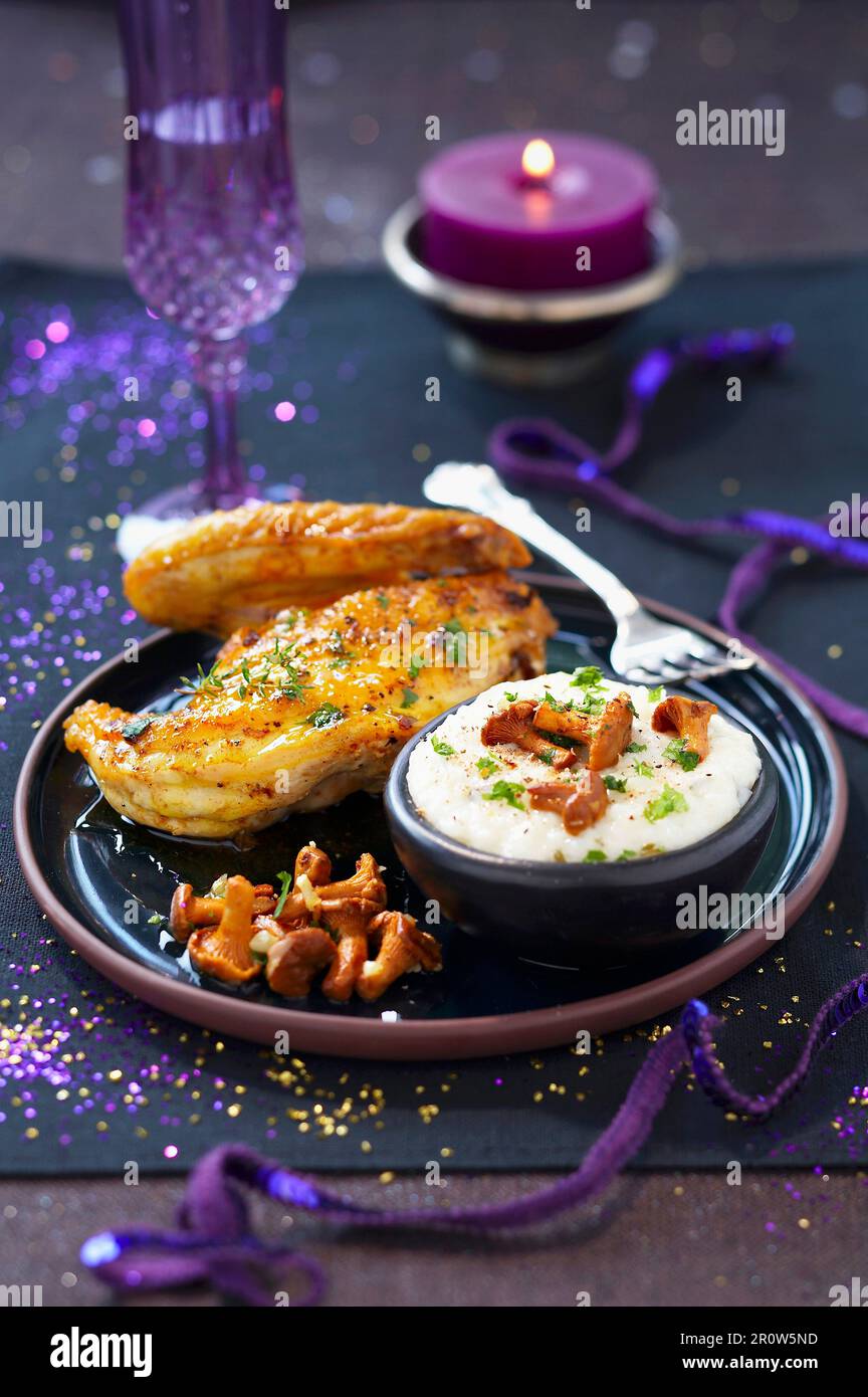 Roast capon with chanterelle rice pudding Stock Photo - Alamy