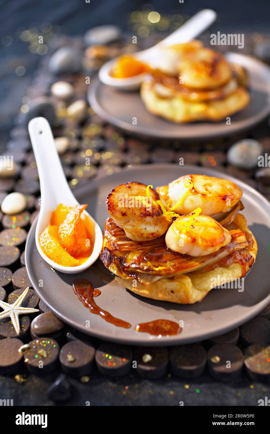 Scallops with madarine-flavored oil and chicory savory Tatin tart Stock ...
