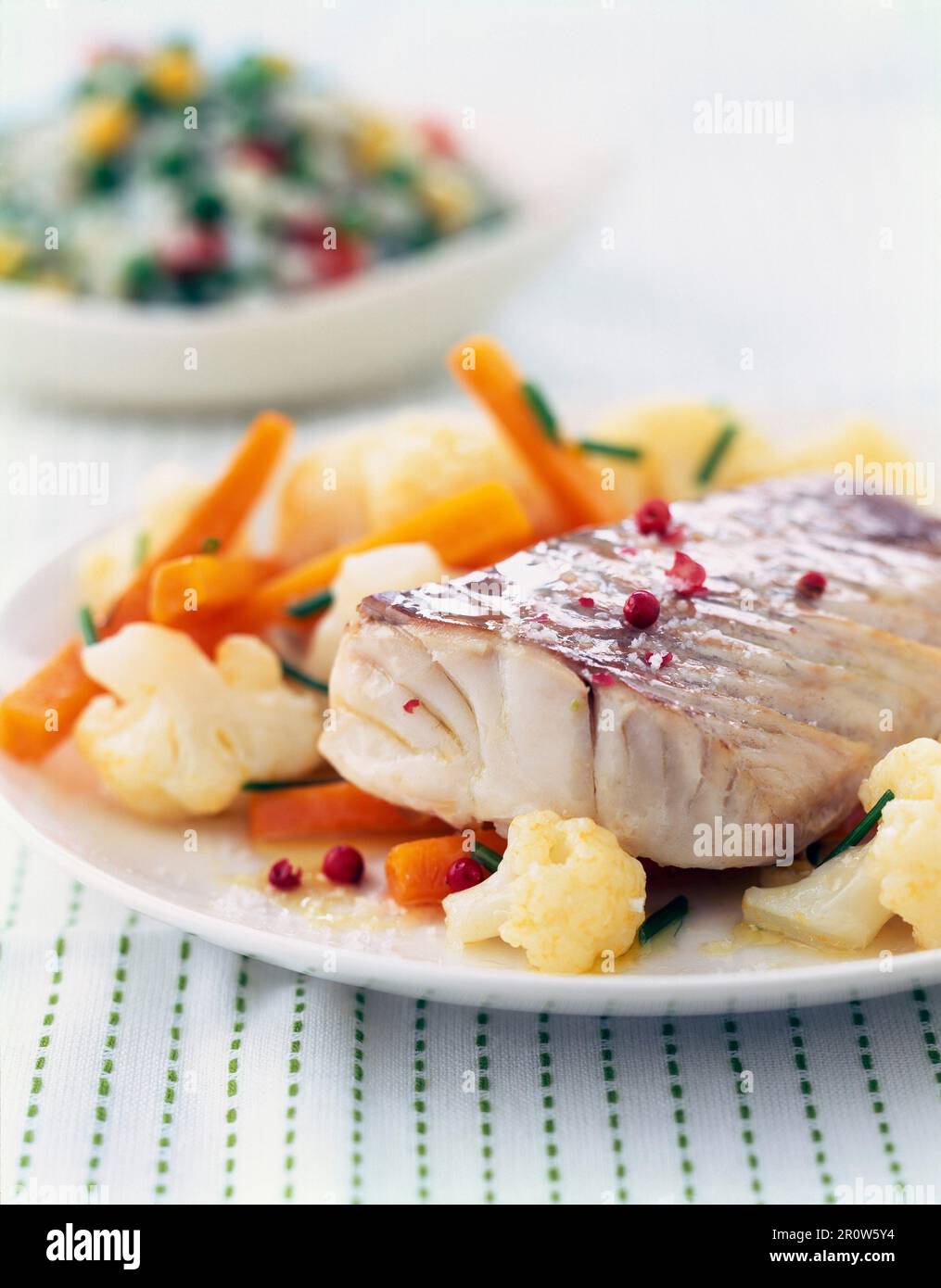 Thick piece of cod with vegetables Stock Photo - Alamy