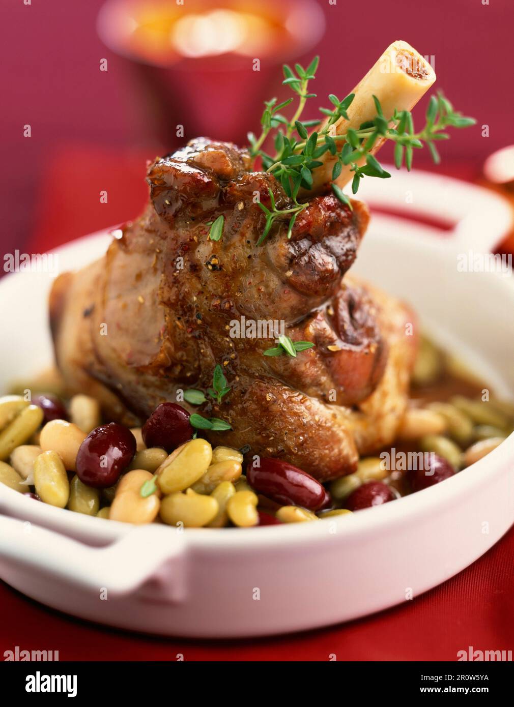 Knuckle of lamb with two types of beans Stock Photo - Alamy