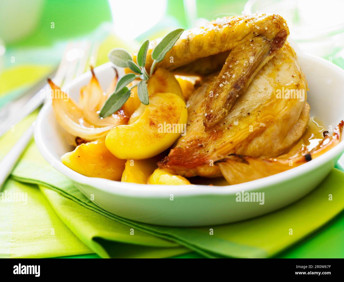 Roast chicken with apples Stock Photo - Alamy