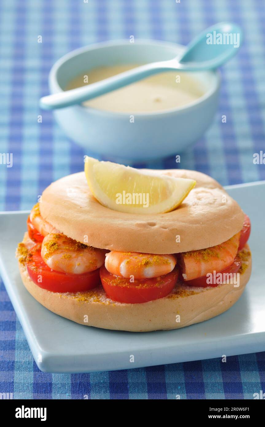 Shrimp,curry and tomato bagel sandwich Stock Photo - Alamy