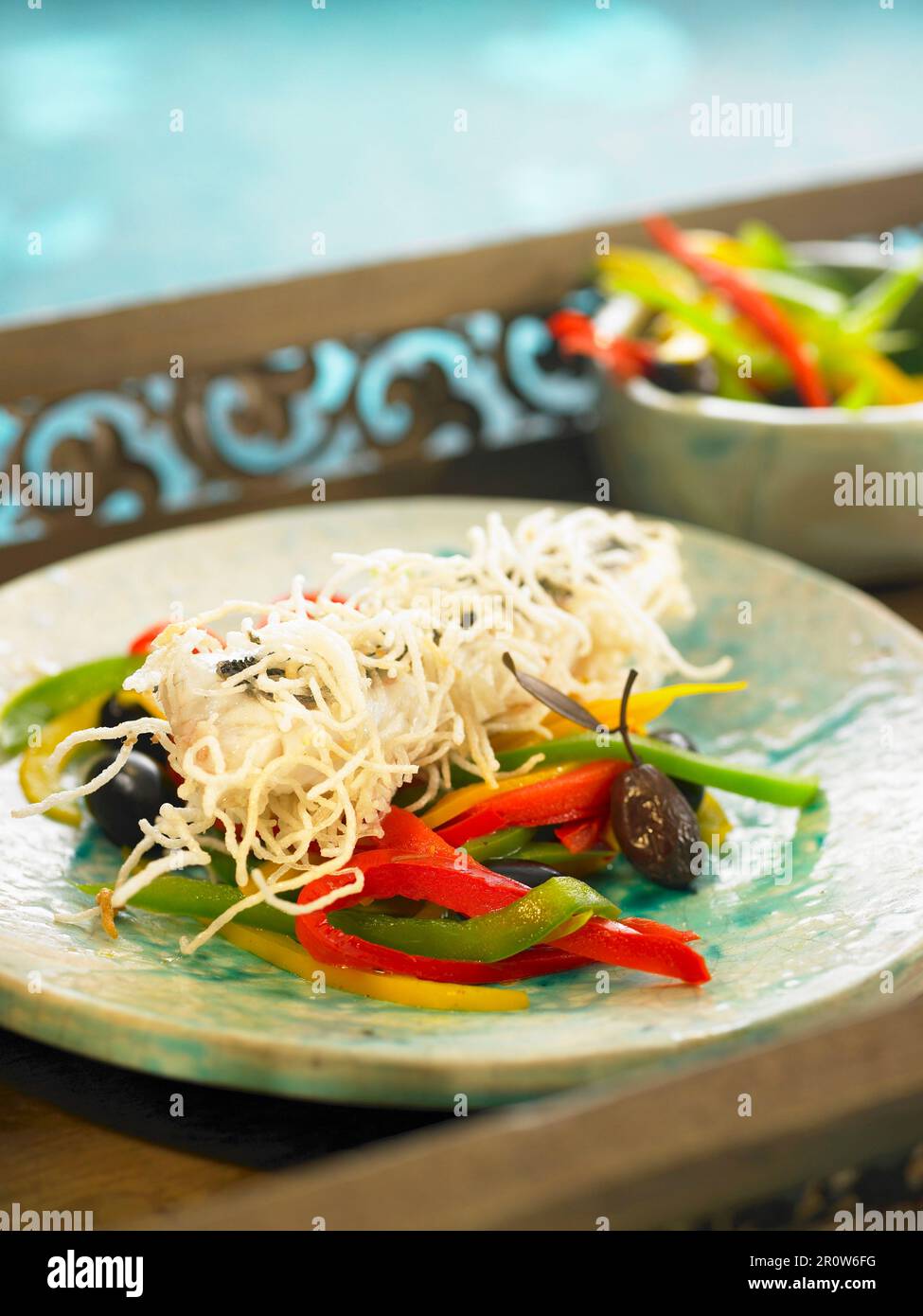 Crisp sea bream with rice vermicellis and peppers Stock Photo - Alamy